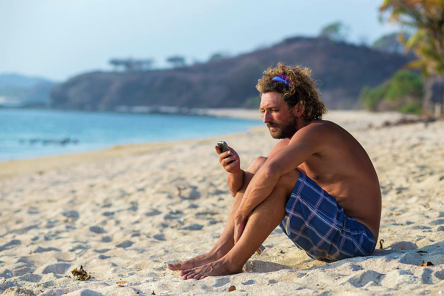Man Calling By Phone On The Beach Photograph by Konstantin Trubavin - Fine Art America