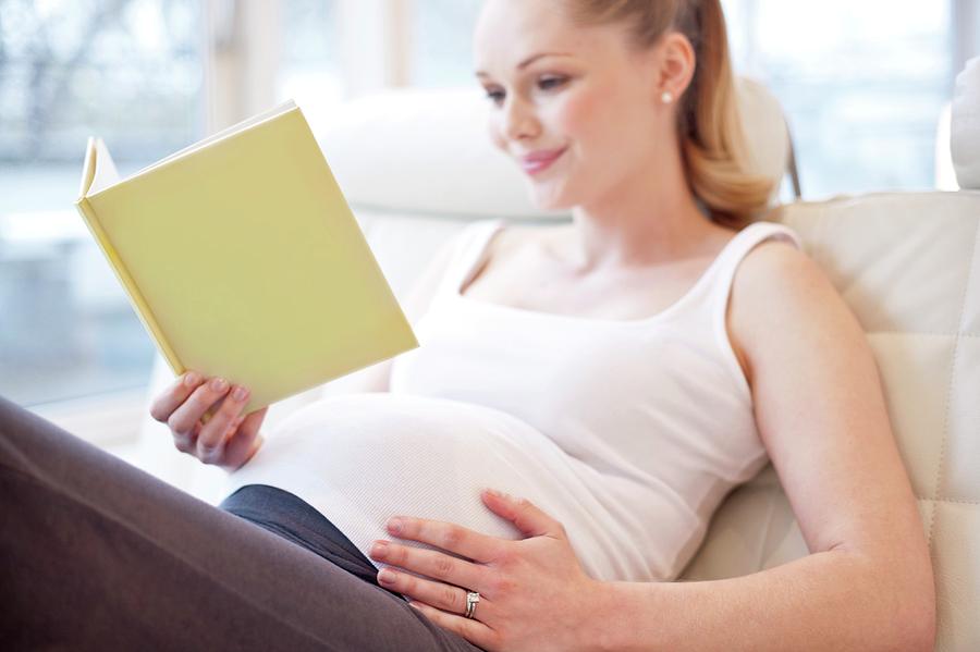 Pregnant Woman Reading Book Photograph By Ian Hooton Science Photo