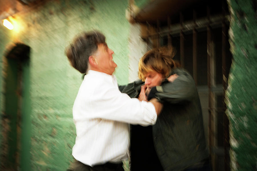 Two Men Fighting Photograph by Ron Koeberer - Fine Art America