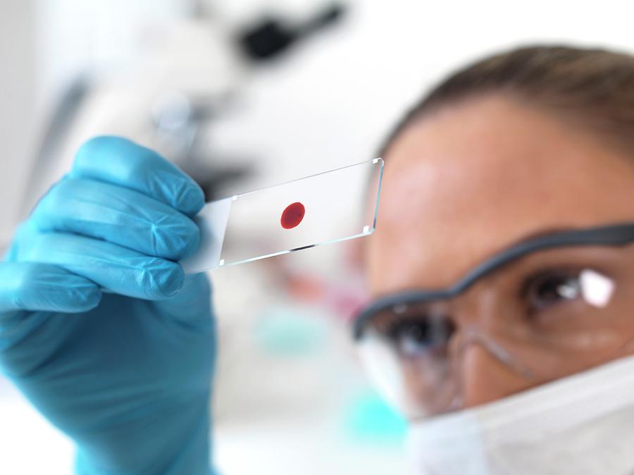 Scientist With Microscope Slide #4 by Tek Image / Science Photo Library