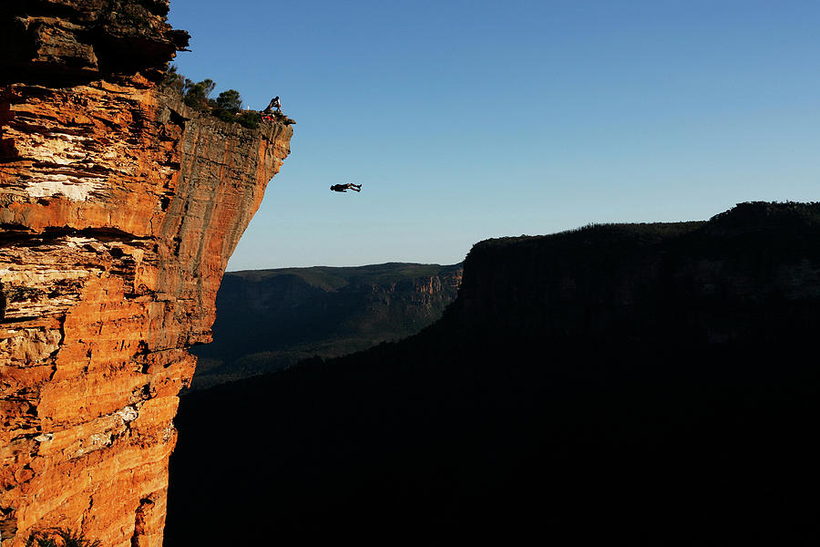 A Base Jumper Back Flips Off A Cliff Photograph by Krystle Wright ...