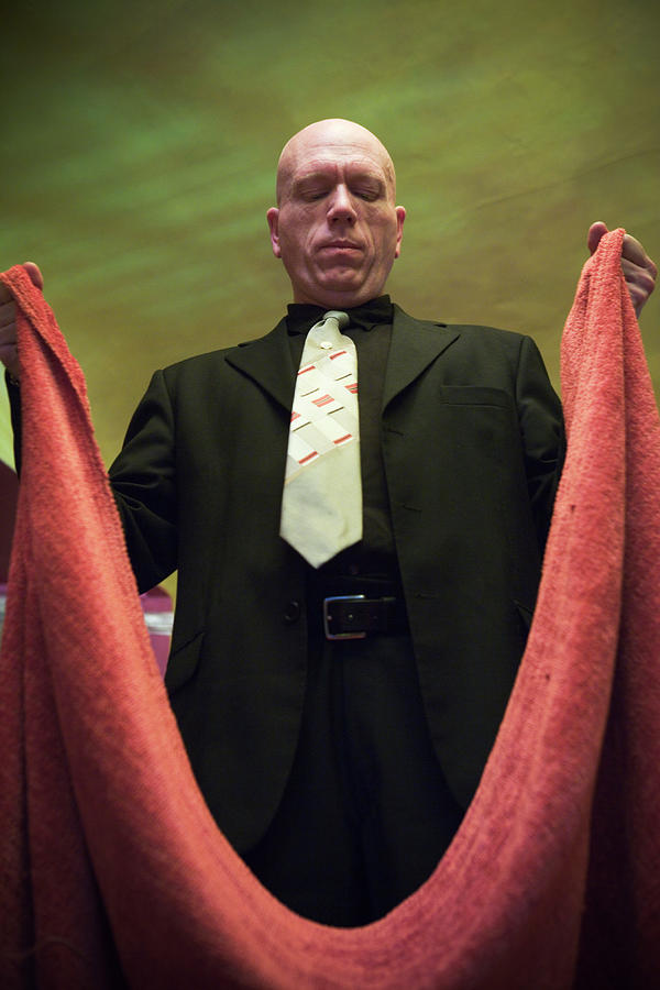 A Man Holding Red Cloth Photograph by Ron Koeberer - Fine Art America
