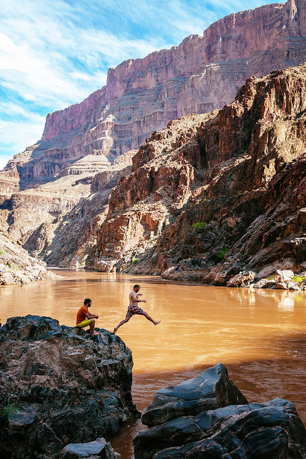 A Man Jumps Into The Colorado River Photograph by Andrew Peacock - Fine ...
