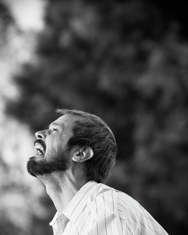 A Screaming Man Looking Up Photograph by Ron Koeberer - Pixels