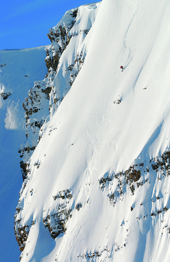 A Skier Flies Down Snowy Cliff Photograph by Lucas Gilman | Fine Art ...