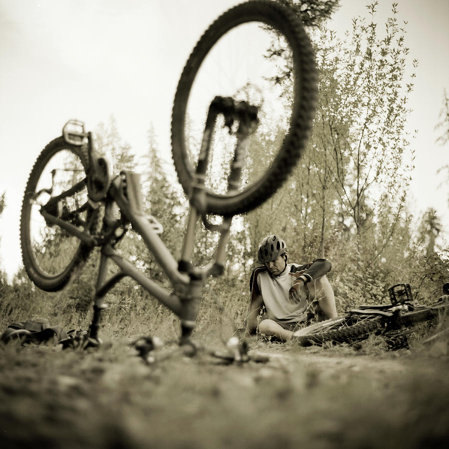 A Young Man Looks Dejected While Doing Photograph by Kari Medig - Fine ...