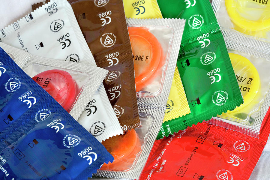 Assortment Of Coloured Condoms Photograph By Adam Hart Davisscience Photo Library Fine Art