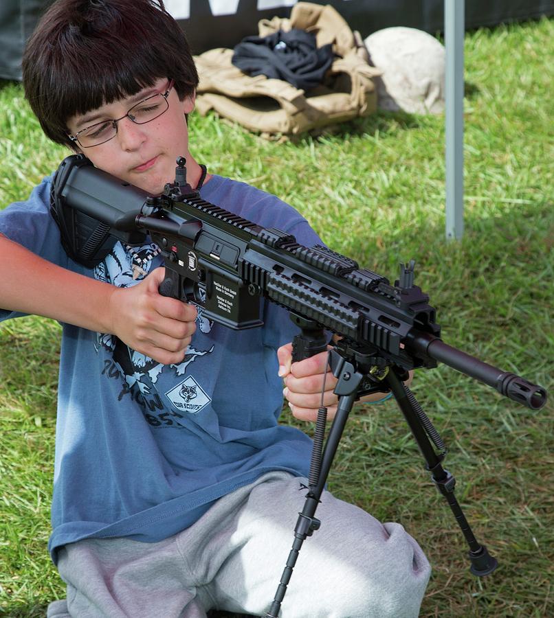Boy With Automatic Rifle Photograph by Jim West - Pixels