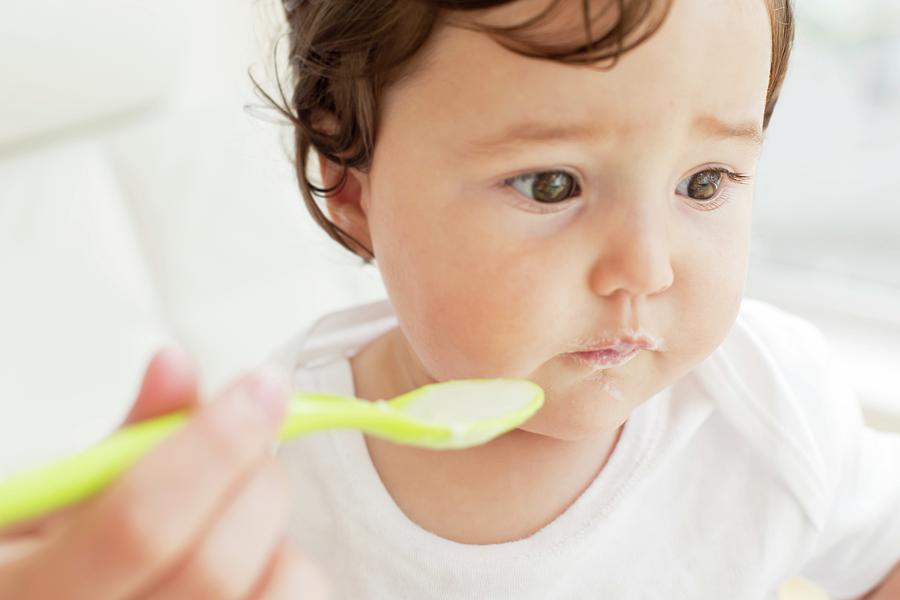 Female Toddler Being Spoon Fed Photograph by Science Photo Library ...