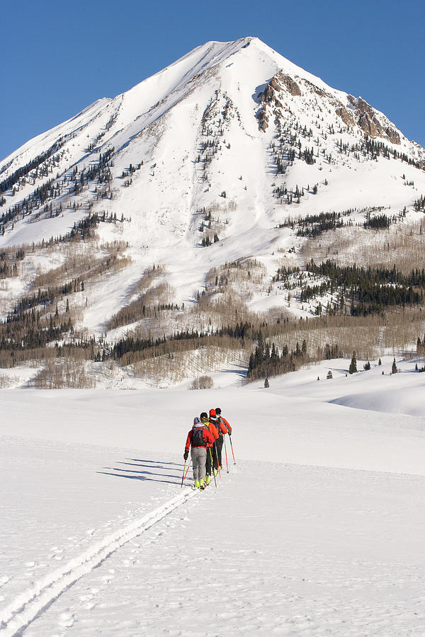 Four Skiers Alpine Touring In Colorado Photograph by J.C. Leacock ...