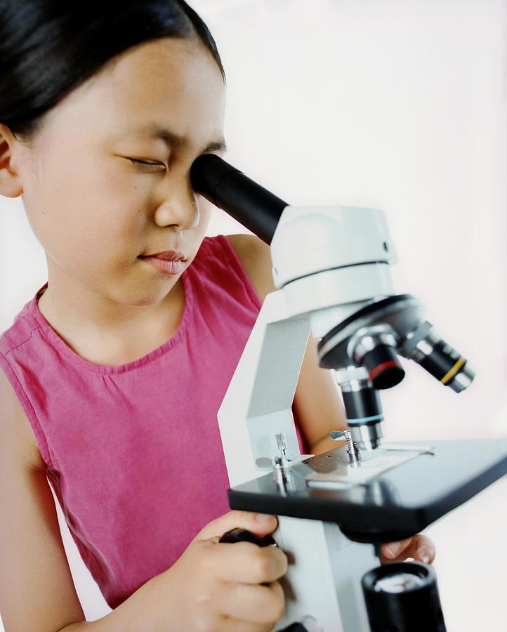 Girl Using A Microscope Photograph by Richard Bailey/science Photo ...