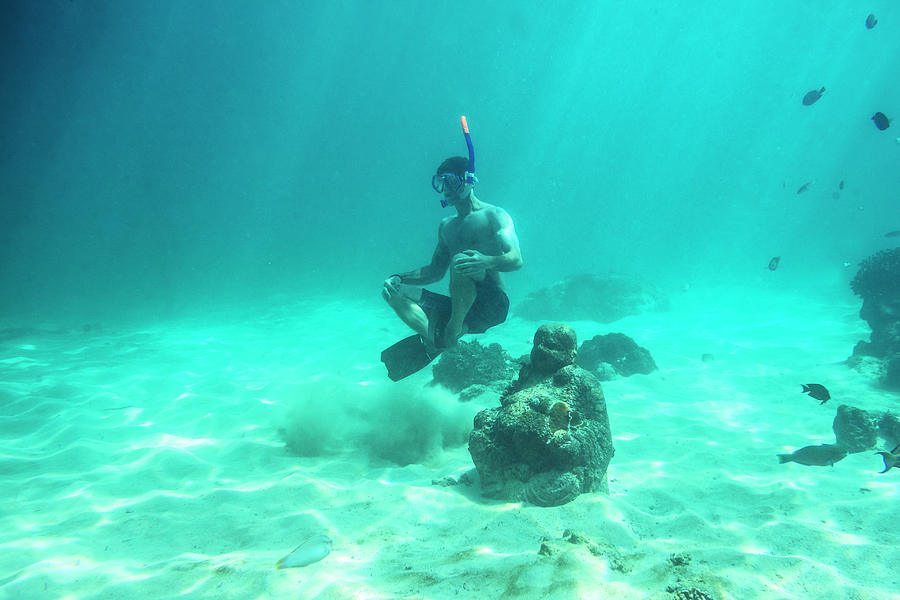 Man Snorkeling In The Ocean Near Buddha Photograph by Konstantin Trubavin - Fine Art America