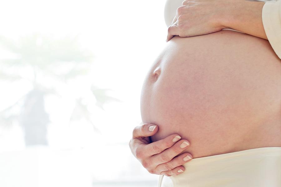 Pregnant Woman Touching Tummy Photograph By Ian Hooton Science Photo