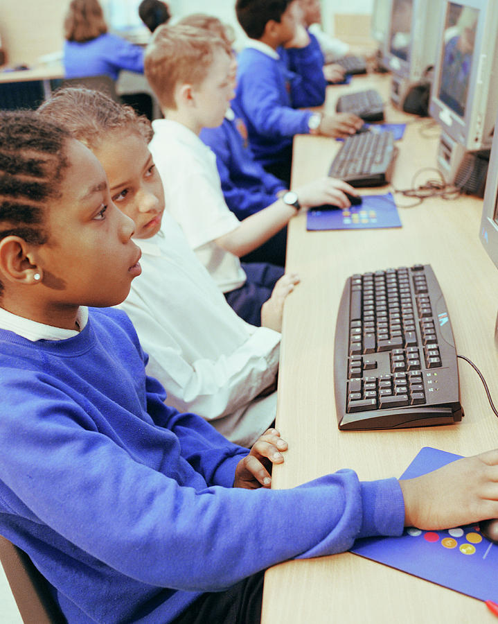 Schoolchildren Using Computers by Science Photo Library