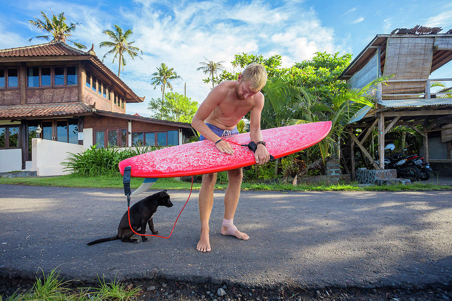 Surfer Is Waxing A Board Photograph by Konstantin Trubavin - Fine Art America