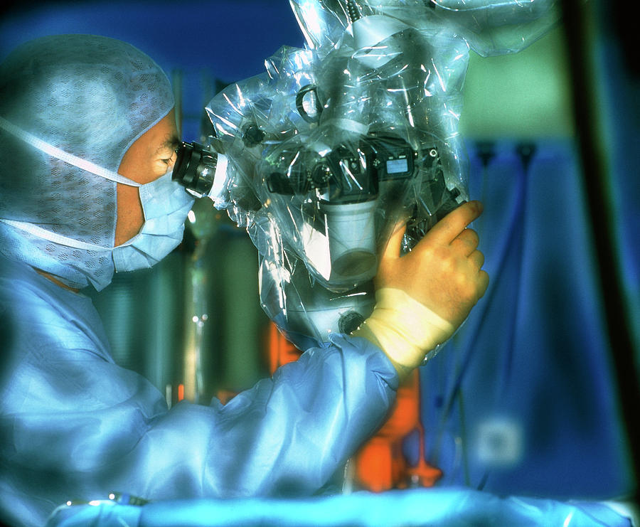Surgeon Using A Microscope During Microsurgery Photograph by Jesse ...
