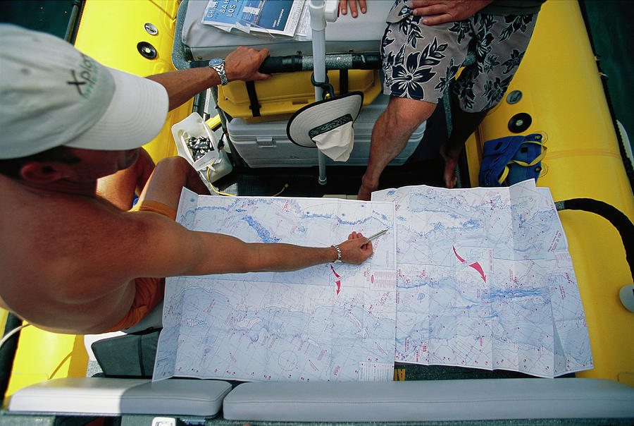 Two Men Looking At A Map Plotting Photograph by Woods Wheatcroft - Pixels