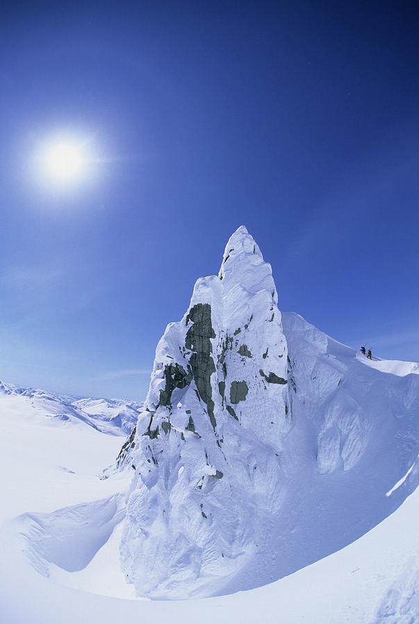 Two Skiers Hiking To A Snowy Peak Photograph by Adam Clark | Pixels