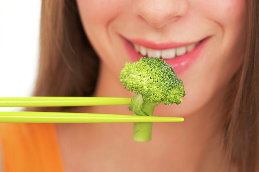 Woman Eating Broccoli Photograph by Lea Paterson/science Photo Library ...