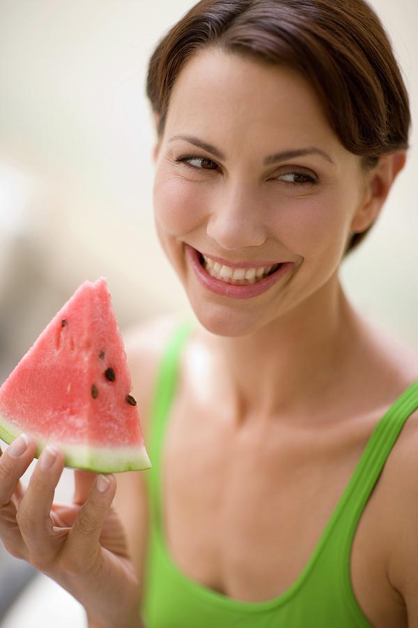 Woman Eating Watermelon Photograph By Ian Hooton Science Photo Library