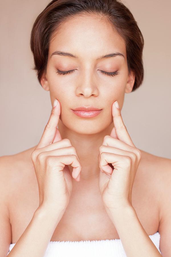 Woman Massaging Her Face By Ian Hooton Science Photo Library
