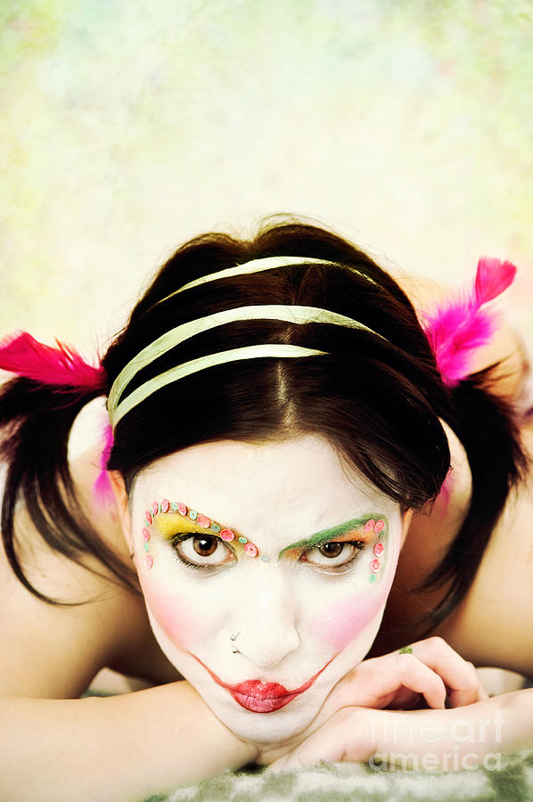 Woman Wearing Clown Makup Giving Quizzical Look To Camera Photograph By