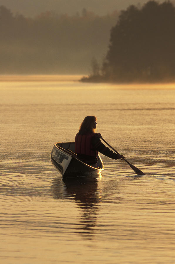 Young Woman Paddling Canoe On Misty Photograph By Henry Georgi Pixels