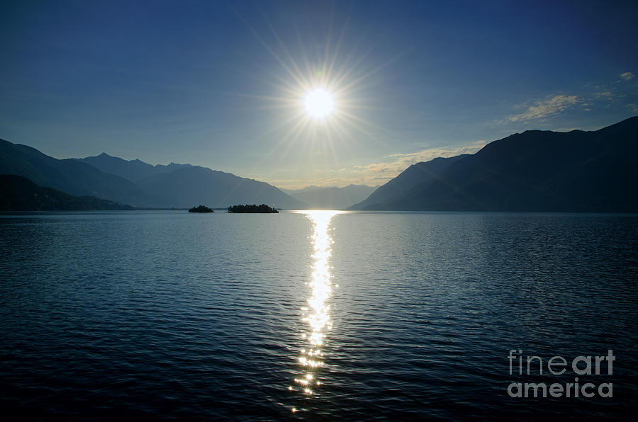 Sunshine over an alpine lake Photograph by Mats Silvan | Fine Art America