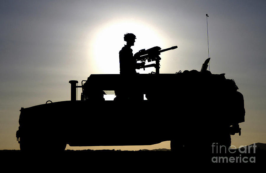 A Gunner Mans An Mk-19 40mm Machine Gun Photograph by Stocktrek Images