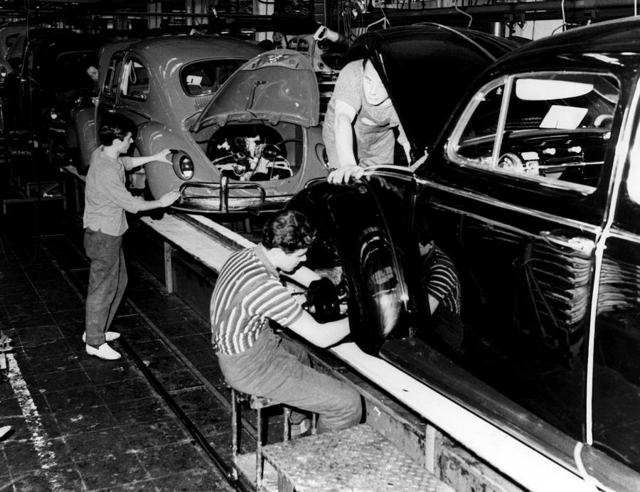 Men Work On The Assembly Line by Everett