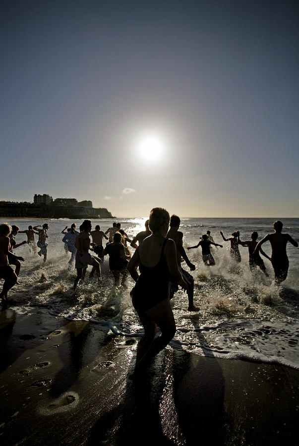 People Running Into The Sea Photograph by Carlos Dominguez - Fine Art ...