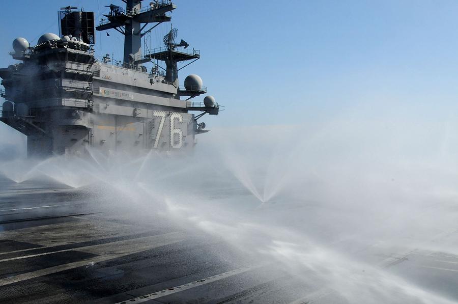 Sprinklers Spray The Flight Deck Photograph by Everett