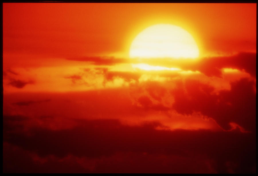 Sun Setting Behind Clouds Photograph by David Nunuk - Fine Art America