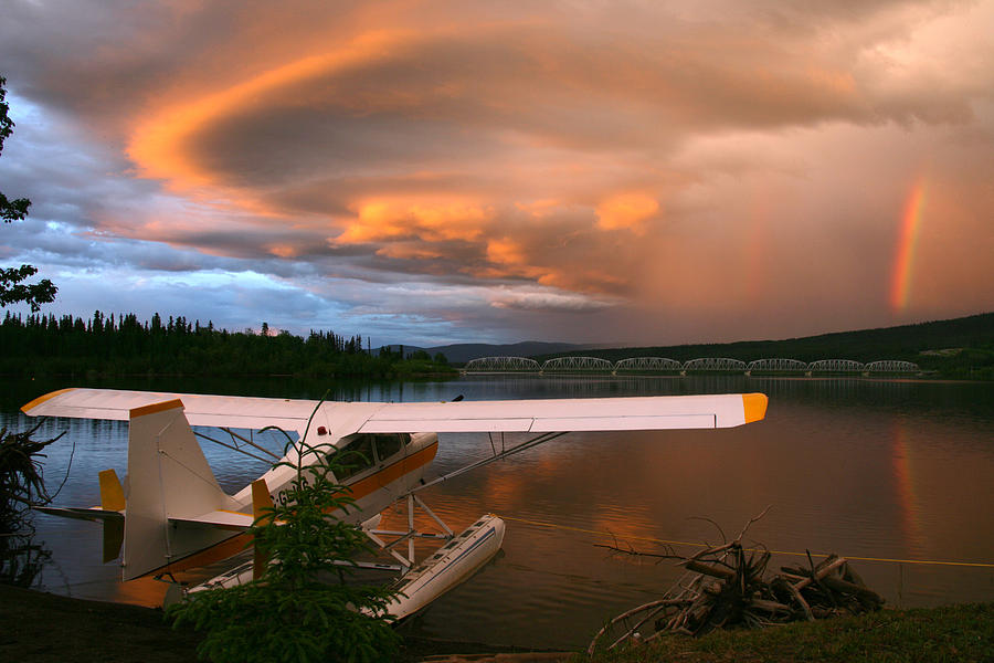 Sunlit Storm Clouds Over A Float Plane Photograph by Robert Postma ...