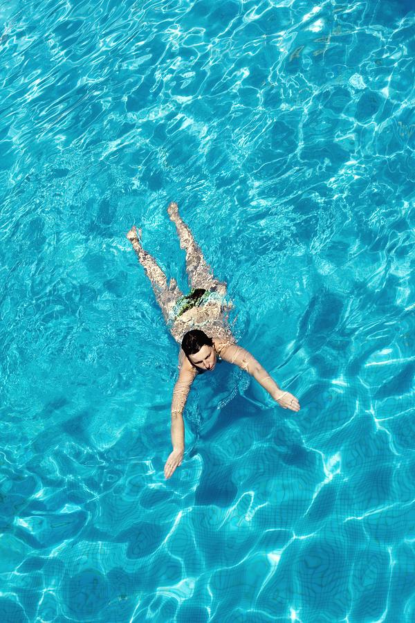 Woman Swimming In A Pool Photograph by Carlos Dominguez - Fine Art America