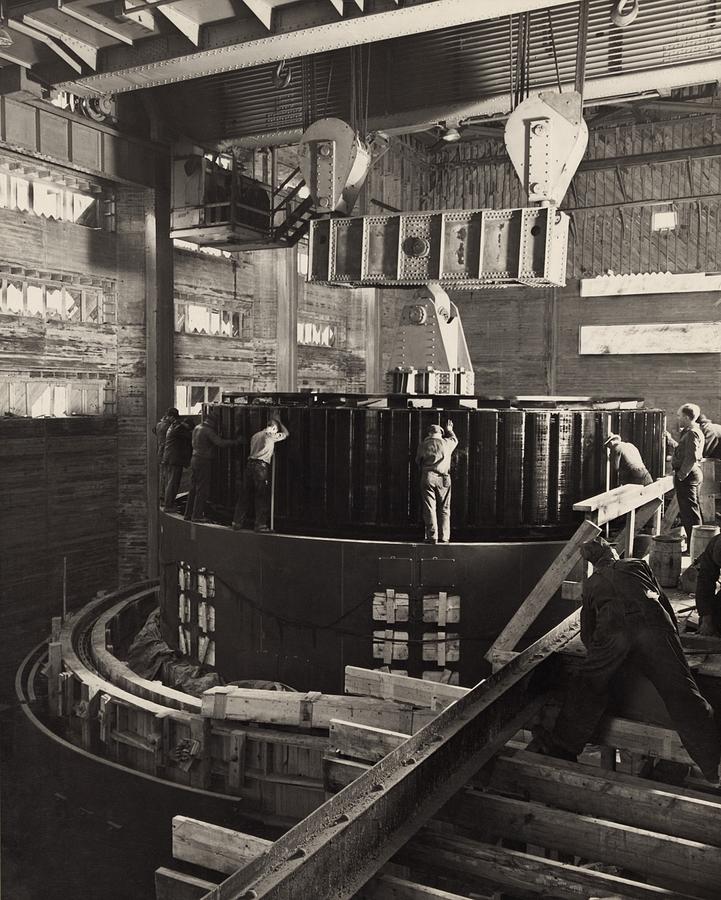 Workmen Installing A Generator Photograph by Everett - Fine Art America