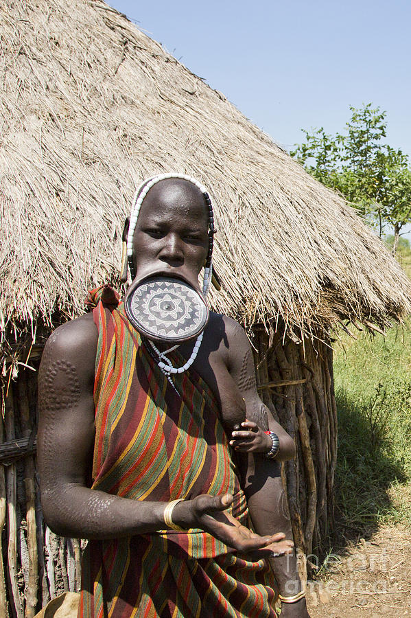 Mursi woman with clay lip disc Photograph by Eyal Bartov - Fine Art America