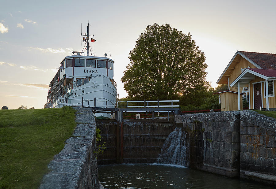 A passenger ship passes the gateway in the old channel Photograph by ...