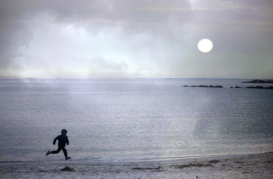Boy at beach in Winter Photograph by Janet Argenta - Fine Art America