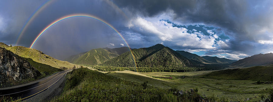 Panoramic View Of Colorful Rainbows Over Road Between Green Hills ...