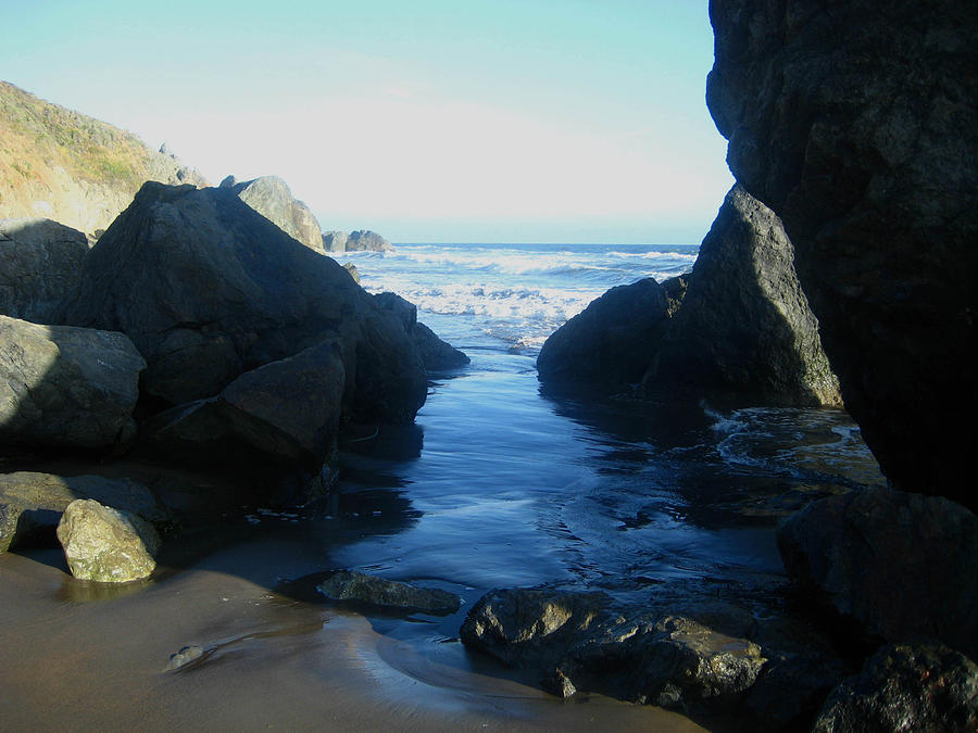 Pathway between rocks and tide Photograph by Andrea Freeman
