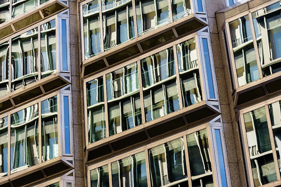 Windows on a Multi-Storey Building Showing Reflections Photograph by ...