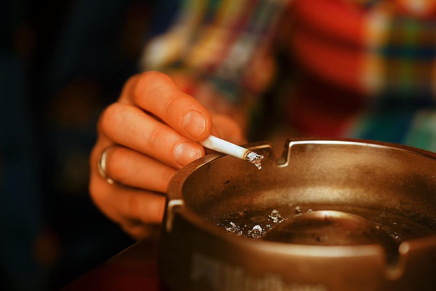 Woman Smoking Cigarette And Using An Ashtray Cigarette In An Ashtray Photograph By Jozef