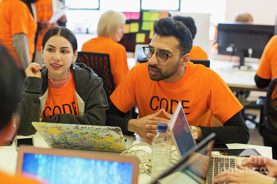 Hackers Coding For Charity At Hackathon Photograph By Caia Imagescience Photo Library
