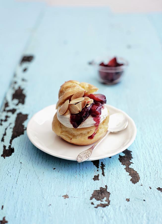 A Profiterole With Caramelised Plums And Amaretto Photograph by Ira ...