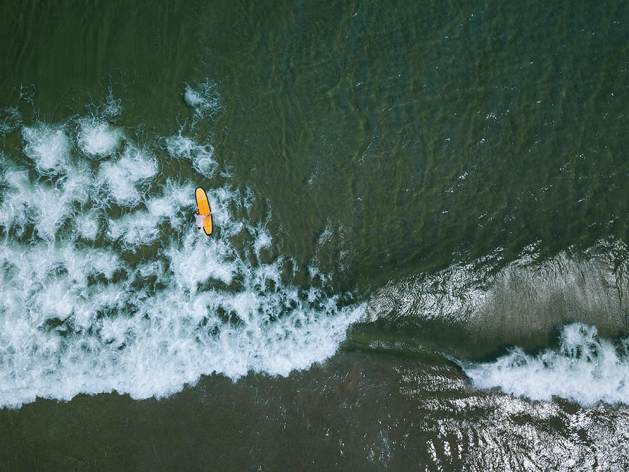 Aerial View Of Man Surfing On Sea At Bali Photograph by Cavan Images ...