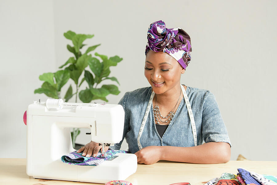 African American Woman Using A Sowing Machine Photograph by Cavan ...