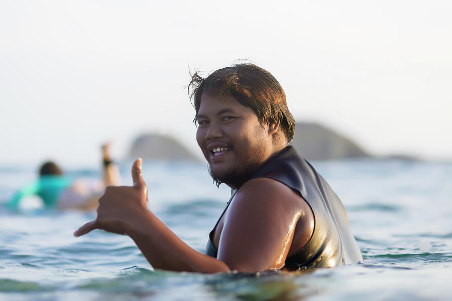Asian Man Swimming In Sea, Kuta Photograph by Konstantin Trubavin - Pixels