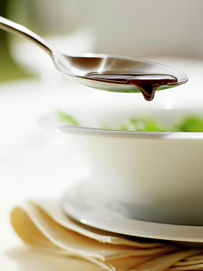 Balsamic Reduction Dripping From A Spoon Photograph by Biglife - Fine ...
