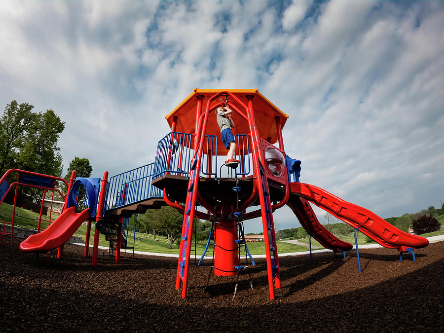 Child Playing On Playground Structure At Park Photograph by Cavan ...